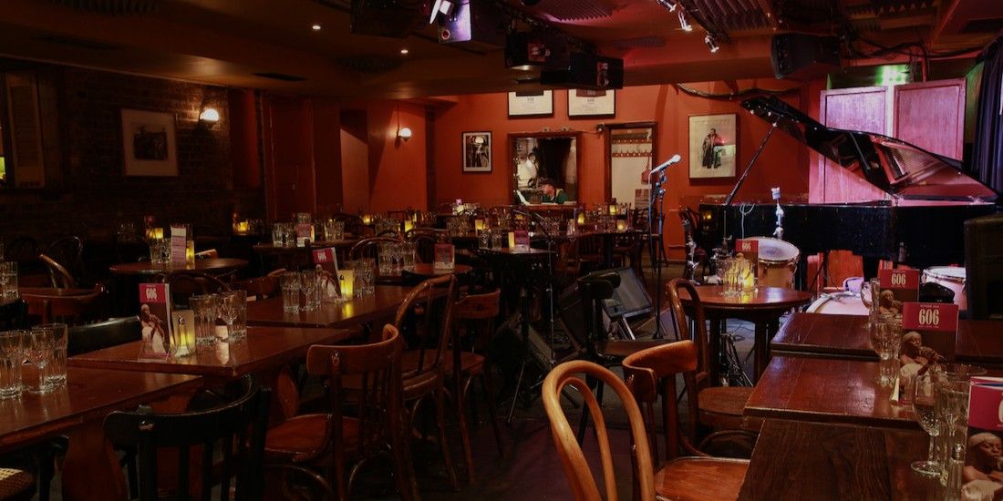 Bustling basement jazz club with speakeasy atmosphere | 606 Club ...